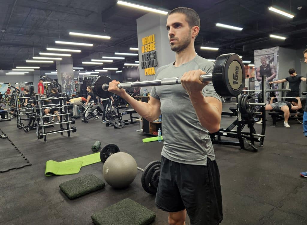 Wide Grip Barbell Curl Guide: How To, Benefits, Mistakes, Alternatives