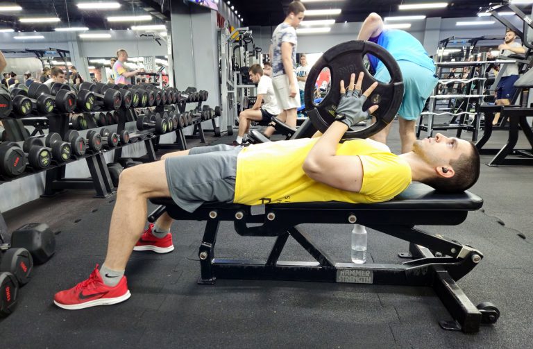 Plate Press Guide: How To, Benefits, Muscles Worked, Mistakes