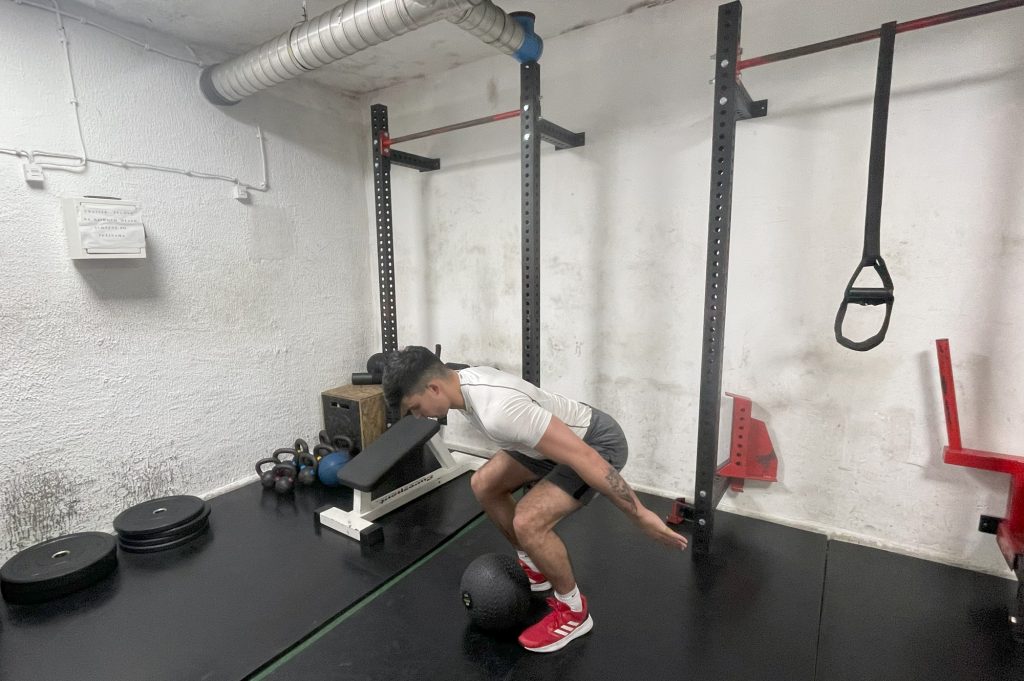 Medicine Ball Slam Guide: How To, Muscles Worked, Benefits, Alternatives